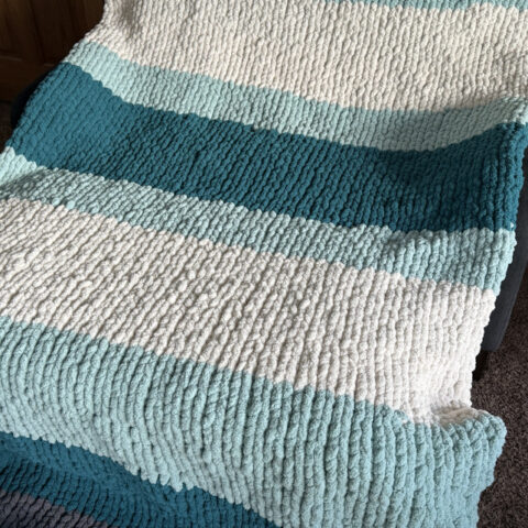 How To Finger Knit A Cozy Blanket With Chunky Yarn - Hands That Bless